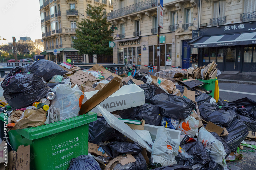 stack of trash bags in the streets of paris during the garbage ...