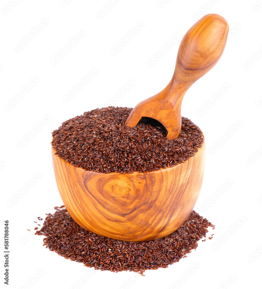 Psyllium seeds in wooden bowl and spoon, isolated on white background ...