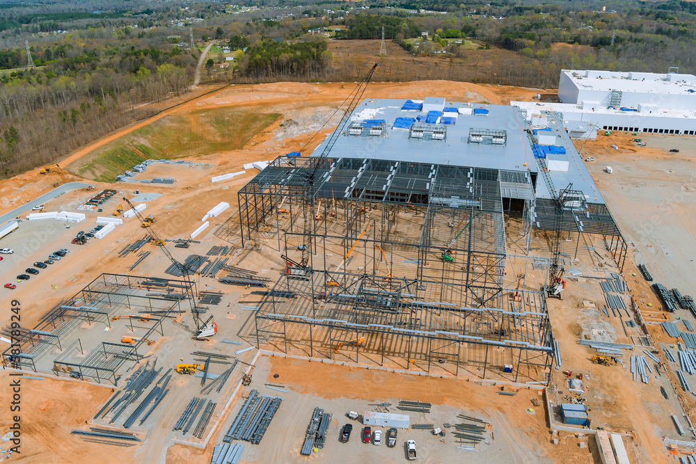 During construction industrial buildings, crawler cranes are used for ...