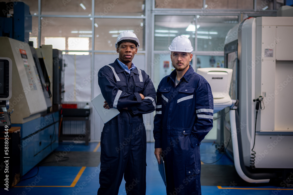 Engineer factory workers shaking hands while working for teamwork and ...