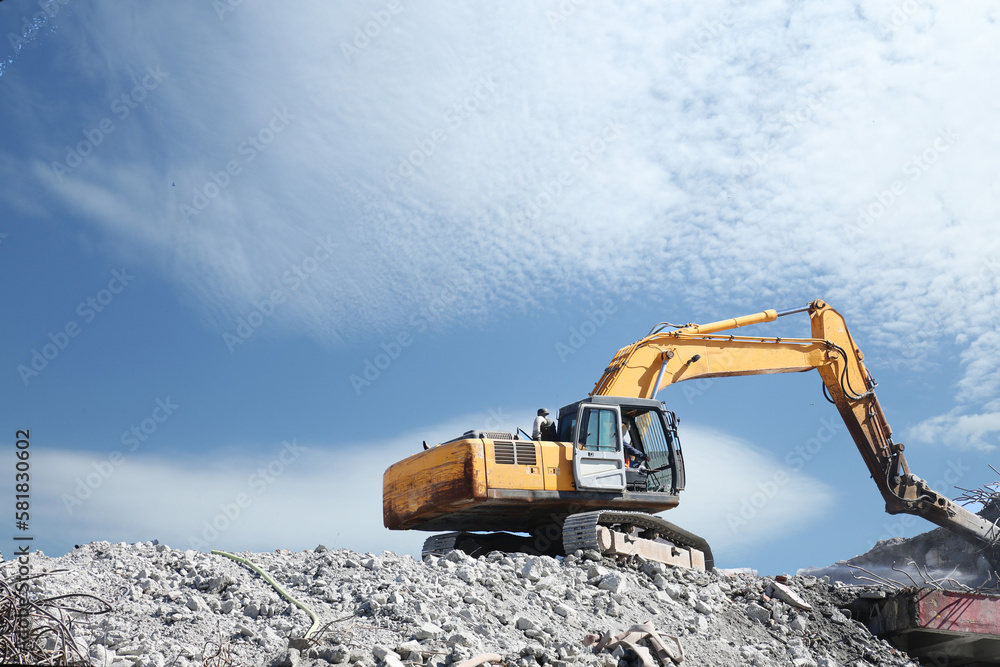 Hydraulic breaker hammer excavator at demolition work. Excavator ...