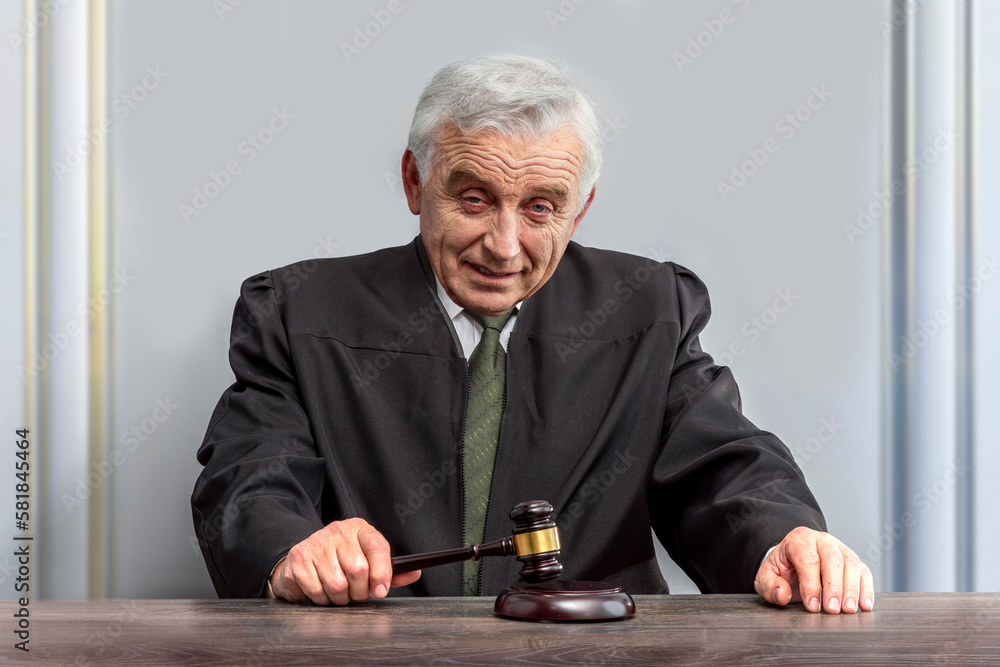 Judge banging judge's gavel. Law Lord wearing gown using a hammer for ...