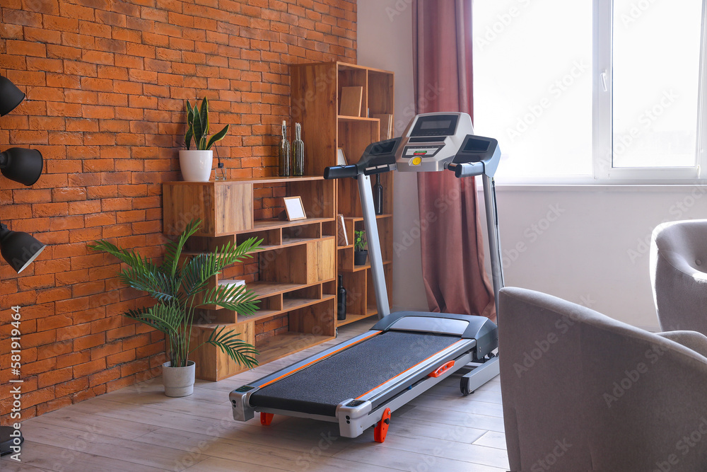 Interior of living room with modern treadmill Stock Photo | Adobe Stock