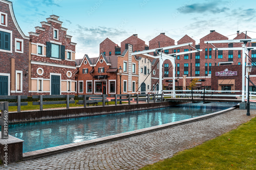 Shopping mall Manufactura. Rows of shops - townhouses in the North ...