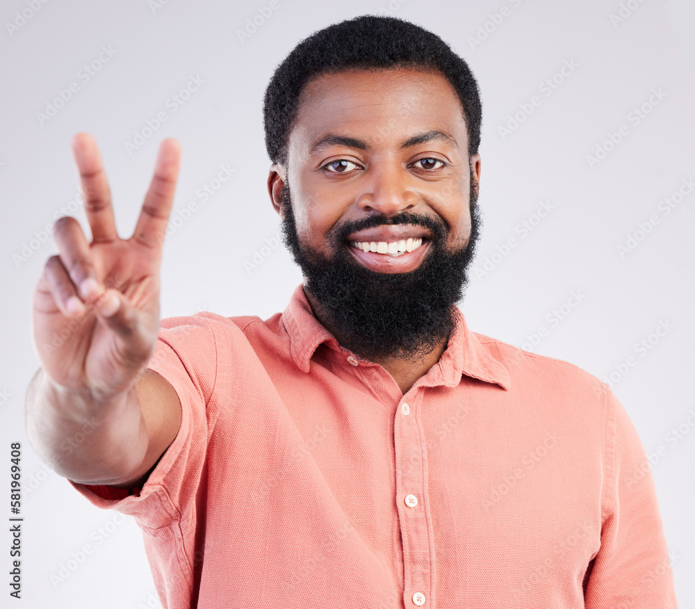Black man, hand and peace sign in studio portrait with smile, emoji or ...