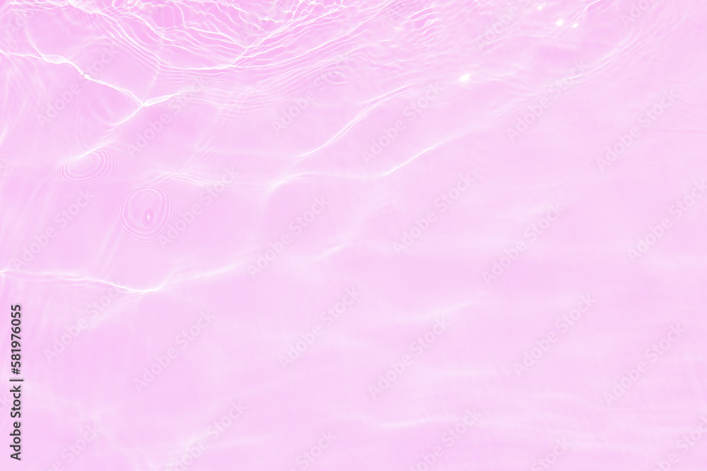 Defocus blurred transparent pink colored clear calm water surface ...