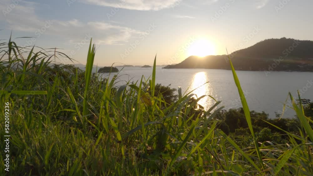 Sunset video at 60 fps. Golden sky with the sun hiding behind the ...