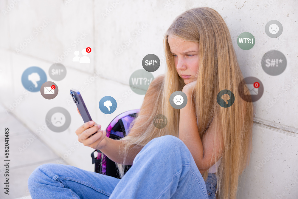 Sad girl viewing negative reactions and comments on social media ...