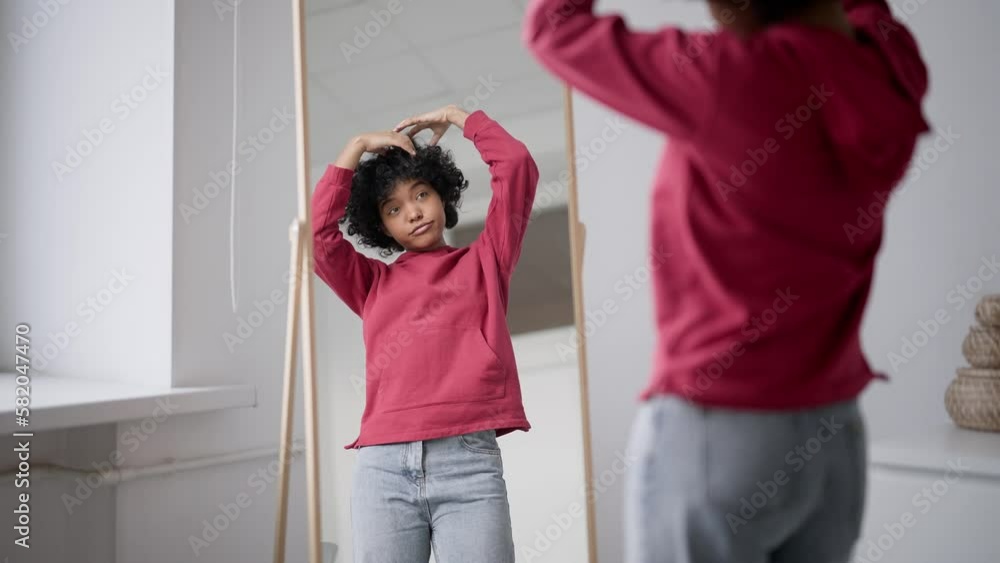 Attractive relaxed carefree african american woman home spinning in ...