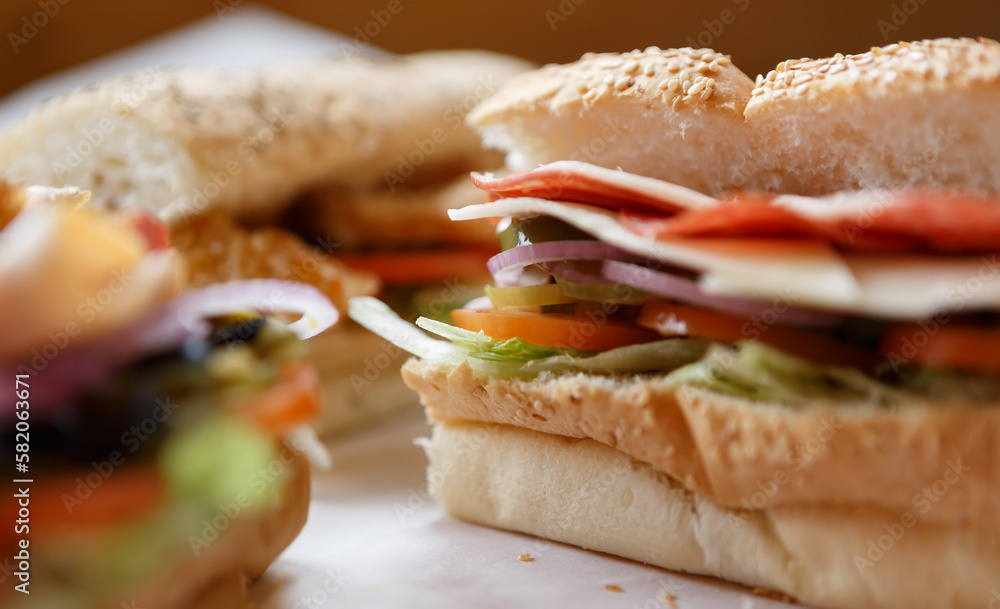 Fresh sandwiches prepared for lunch in a fast food restaurant. Close up ...