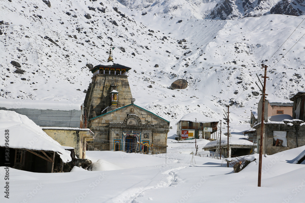 Kedarnath temple, shrine covered with snow. Kedarnath temple is a Hindu ...