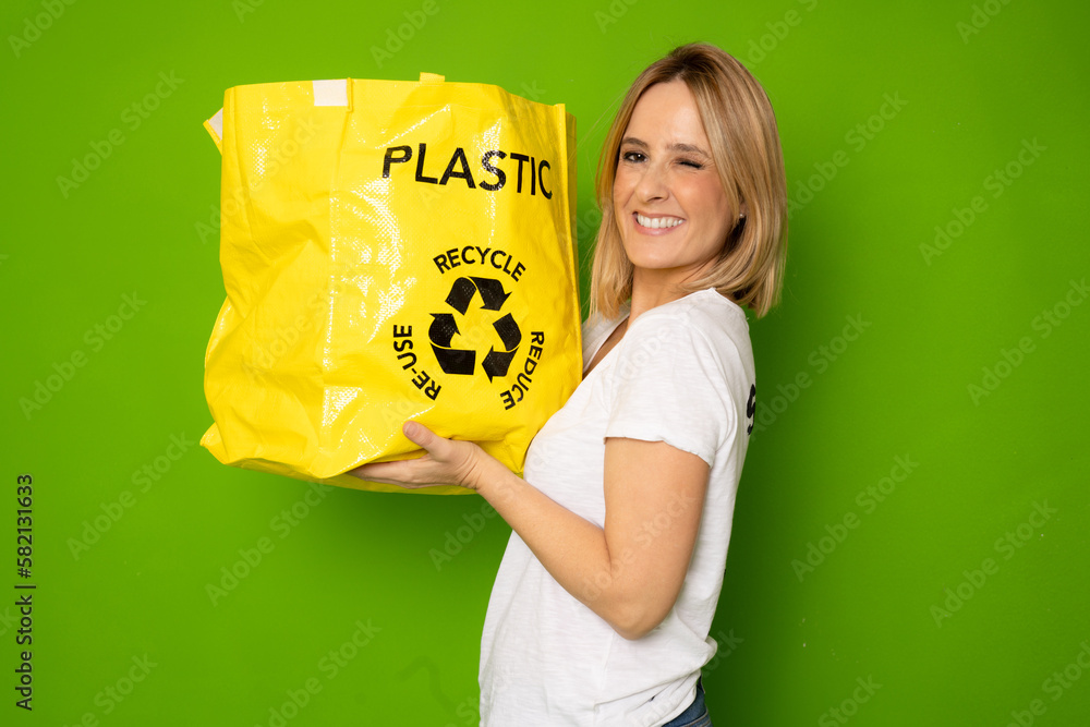 recycling, waste sorting and sustainability concept - smiling young ...