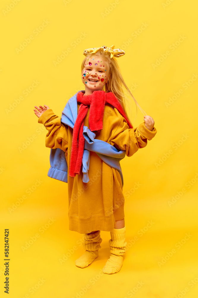 Full-length photo of little girl standing and wearing big clothes ...