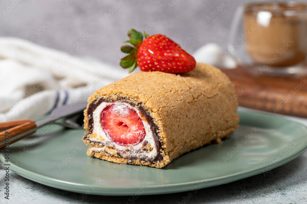 Rolled log cake. Strawberry and cream cake on a stone background ...