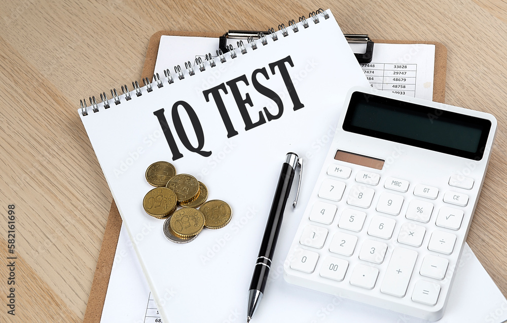 IQ TEST text with chart and calculator and coins , business concept ...