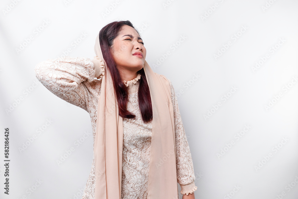 Tired upset young Asian Muslim woman wears headscarf suffering from ...
