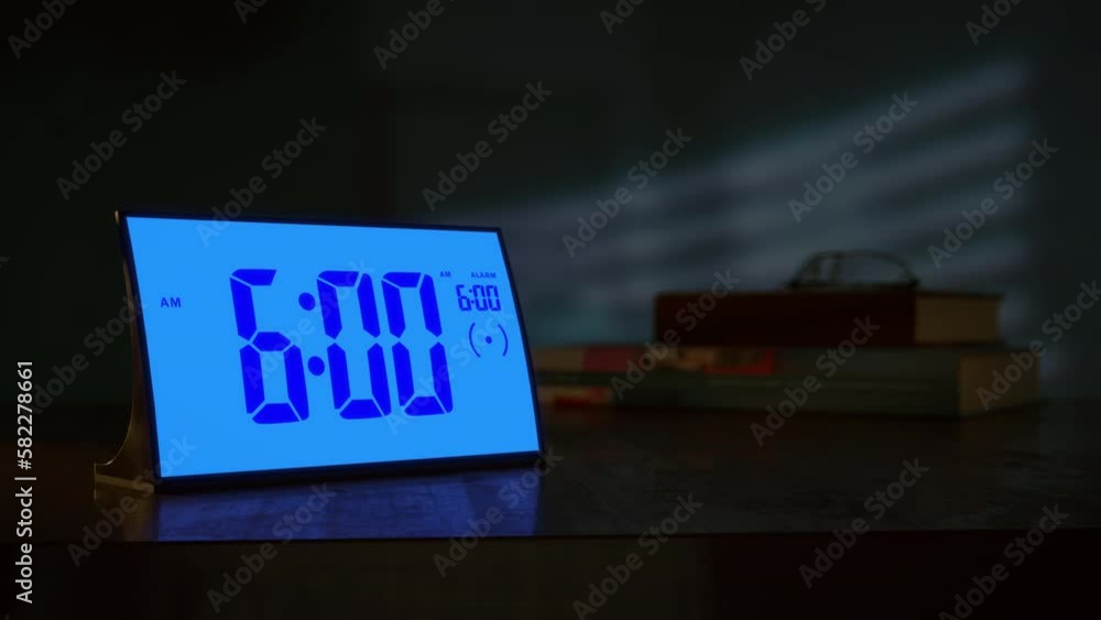 Video „Digital alarm clock waking up at 6 AM. Close-up view. The ...