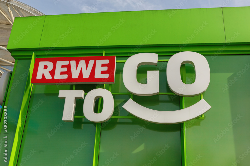 Passau, Bavaria, Germany - March 17th 2023: Logo sign of REWE to go at ...