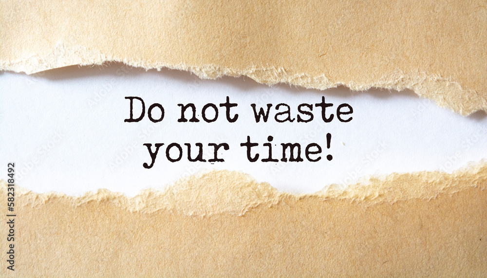 Do not waste your time. Words written under torn paper. Motivation ...
