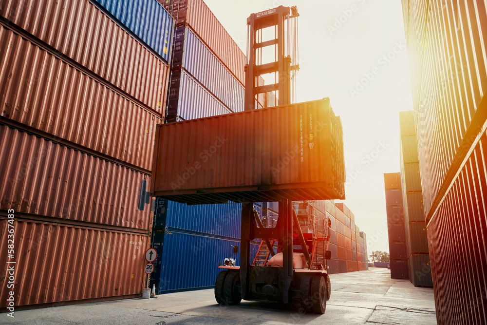 Forklift truck handling cargo shipping container box in logistic ...