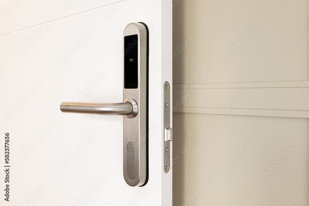 Open front door with electronic mortise lock and handle. The door is ...