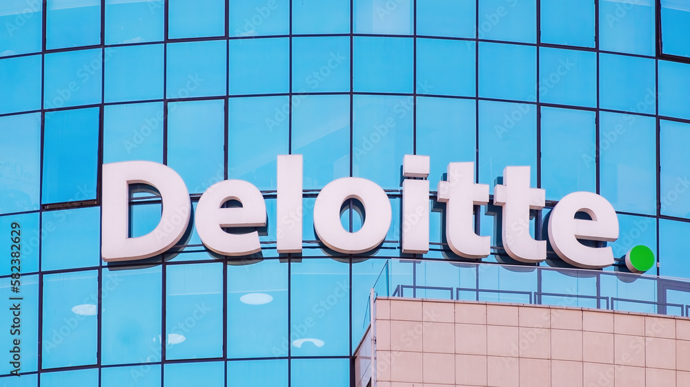 Minsk, Belarus - March 24, 2022: Deloitte sign on the glass facade of ...