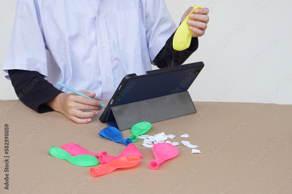 Closeup student writes on smart tablet during studying about static ...