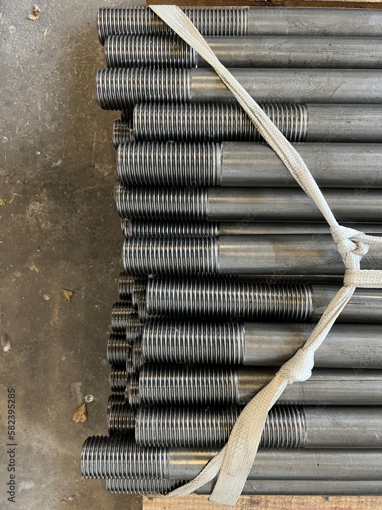 Top view and close-up photo of bolt threads arranged on many floor ...