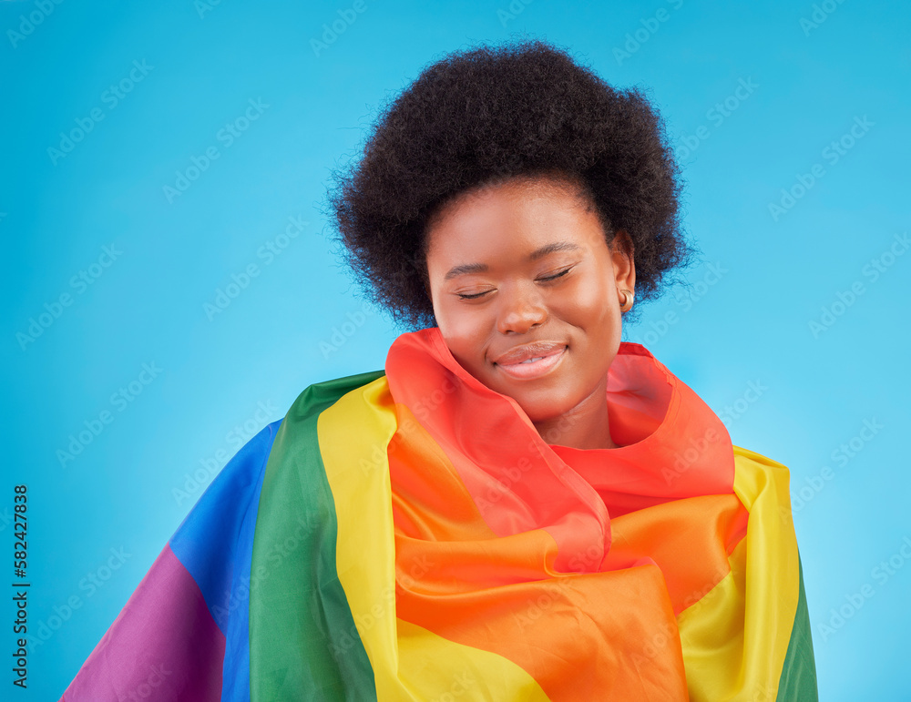 Rainbow, happy and black woman with lgbtq flag in studio for gay ...