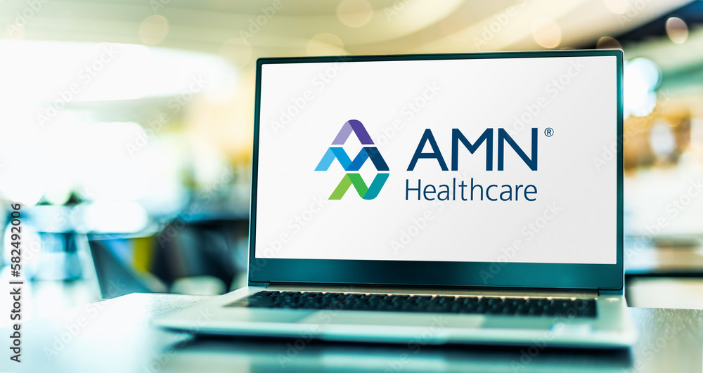 Laptop computer displaying logo of AMN Healthcare Services Stock Photo ...