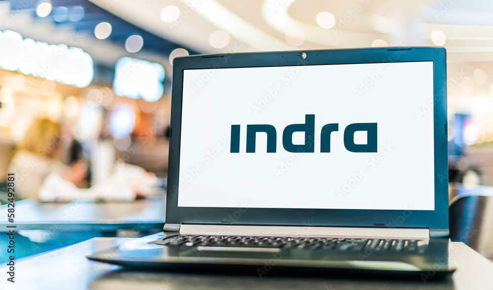 Laptop computer displaying logo of Indra Sistemas Stock Photo | Adobe Stock