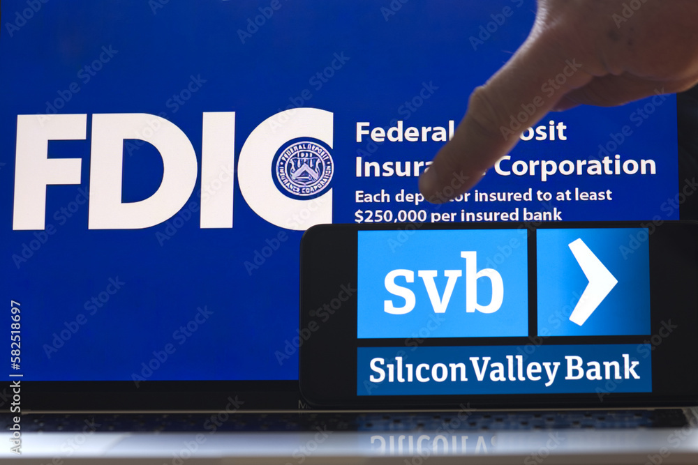 Smartphone with SVB ( Silicone Valley Bank ) logo on background of FDIC ...