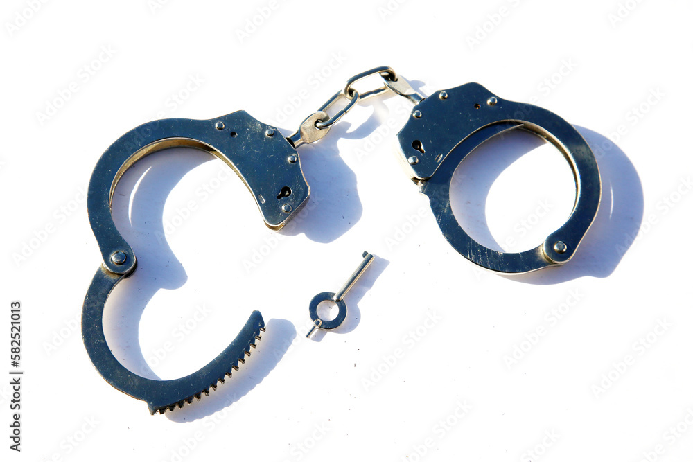 Handcuffs. Hinged Galvanized Handcuffs. Handcuffs isolated on white ...