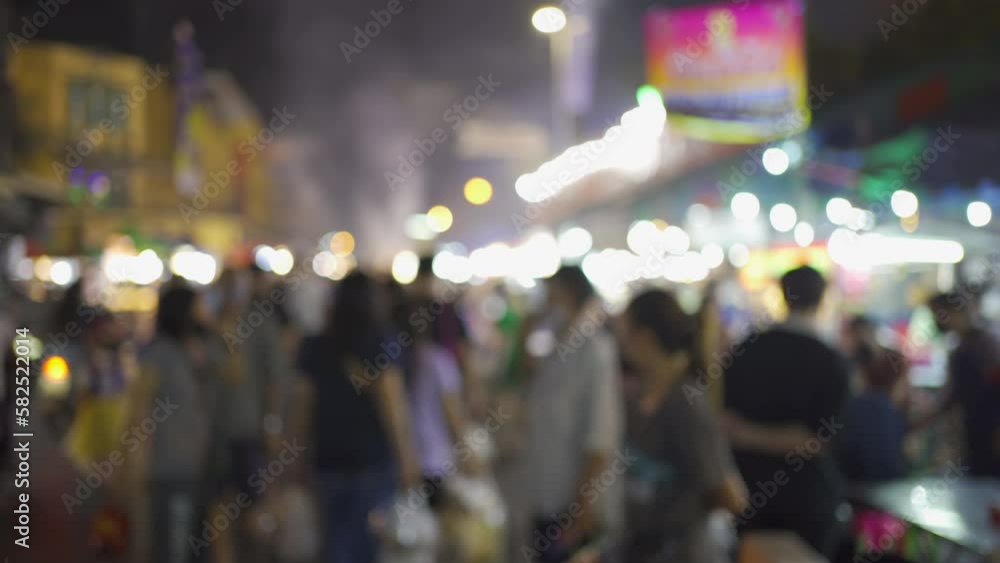 Blurry background. Bokeh of night market. Crowd of people walking ...