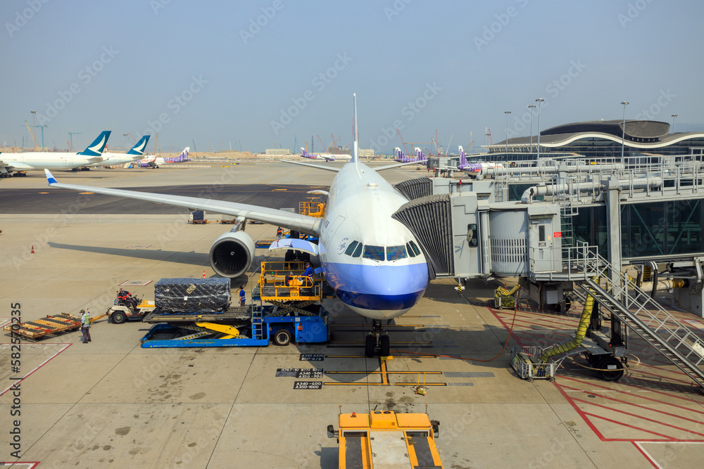 Hong Kong - March 1, 2023: Airplane at boarding gate jet bridge in Hong ...