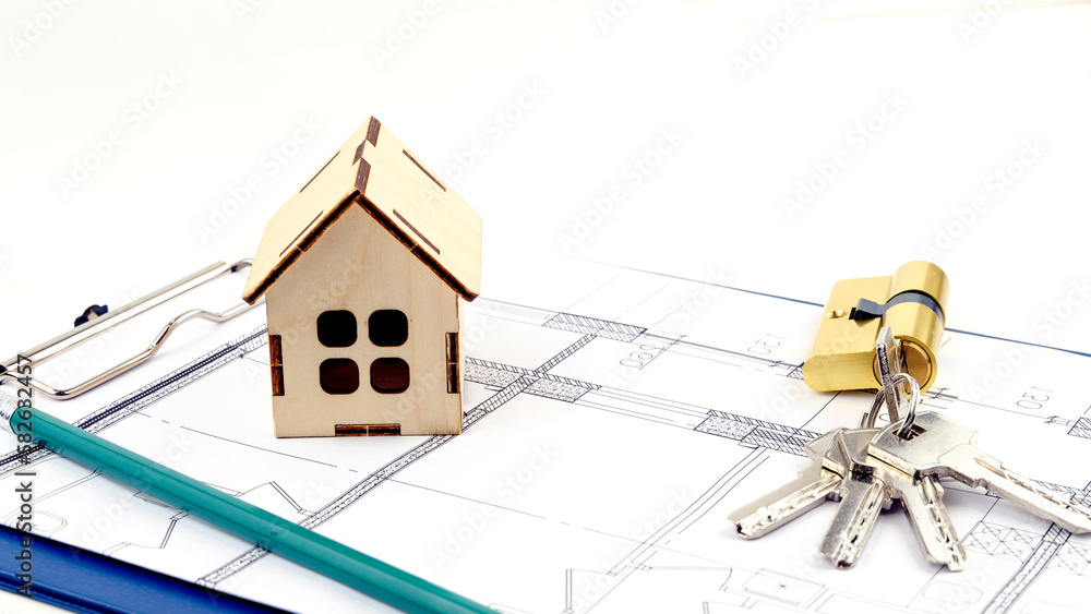 keys and the layout of the house on the drawings. the concept of buying ...