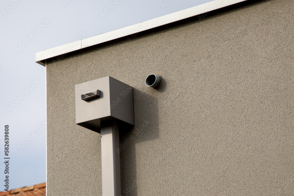 Corner new house with flat roof with modern cube gray gutter pipe Stock ...