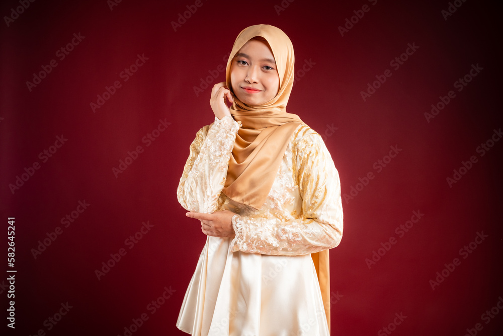 Portrait of a beautiful Asian Muslim female model wearing hijabwear ...