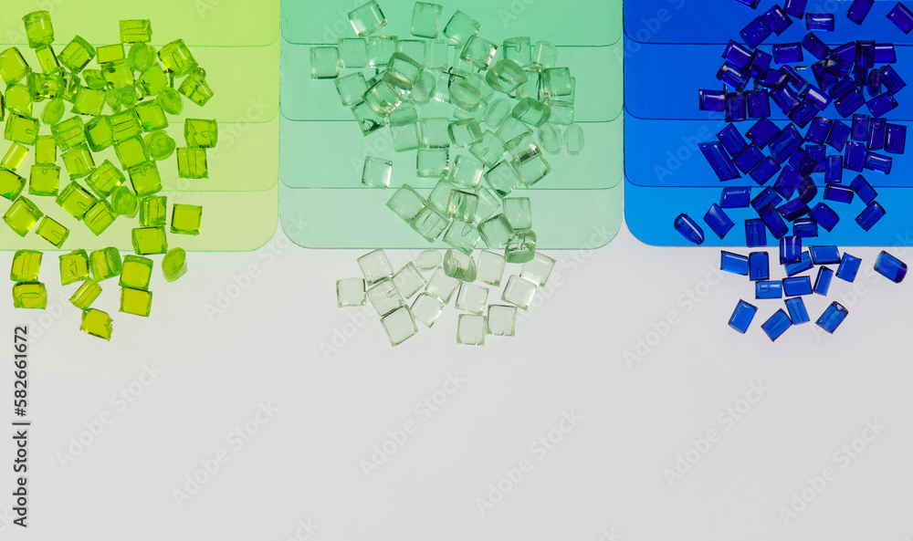 colored transparent plastic resin granulates with color sample plates ...