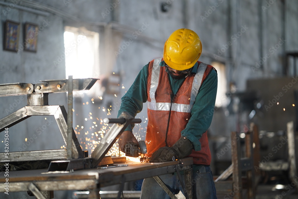 Working with Power Tools - Stock photo of Man Using Angle Grinder with ...