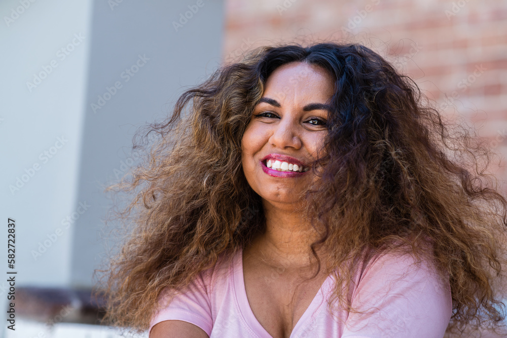 aboriginal woman with curly hair Stock Photo | Adobe Stock