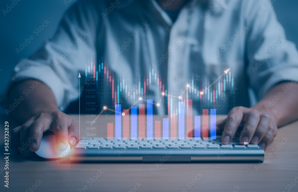 investor or trader displays a virtual stock chart hologram for ...