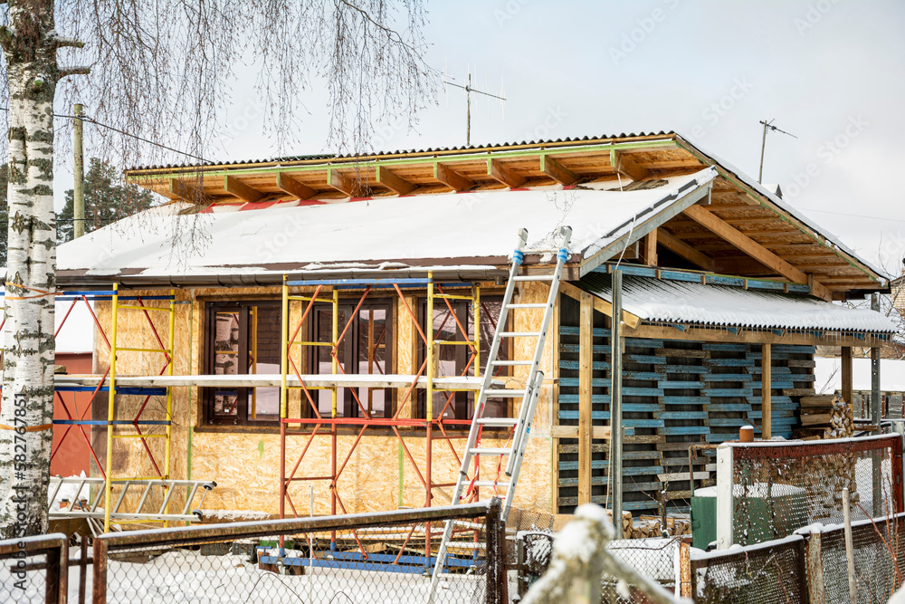 construction of frame houses. a small frame house on a plot Stock Photo ...