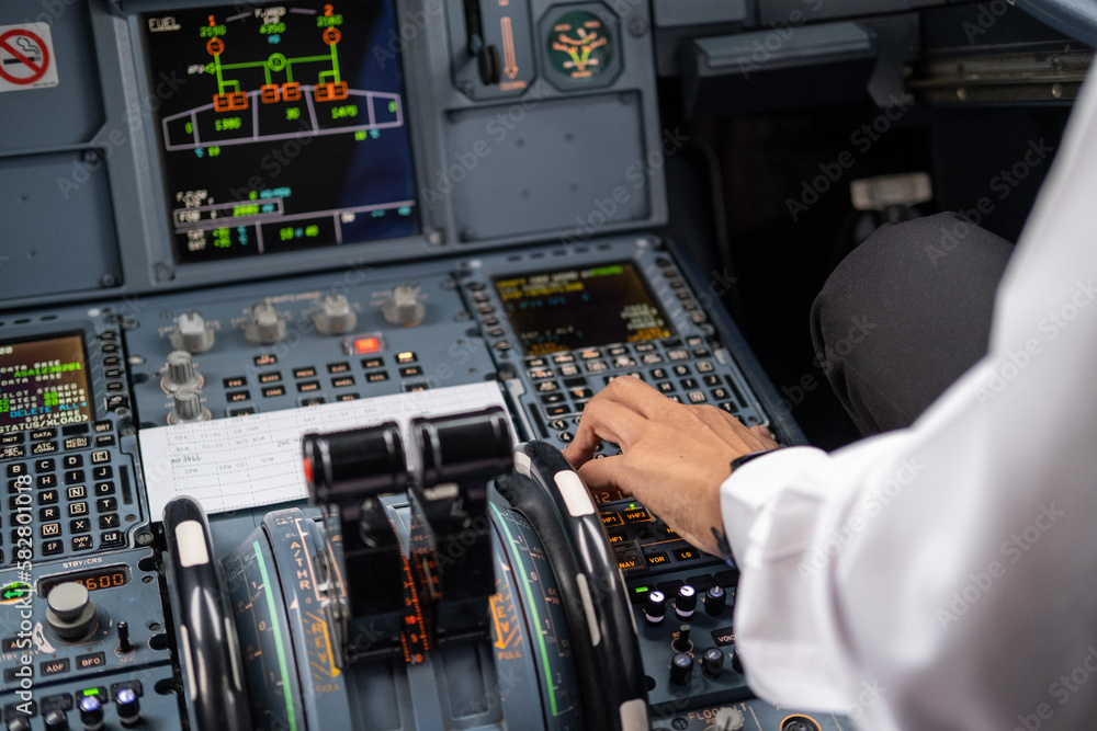 pilot in command setting control panel in cockpit Stock Photo | Adobe Stock