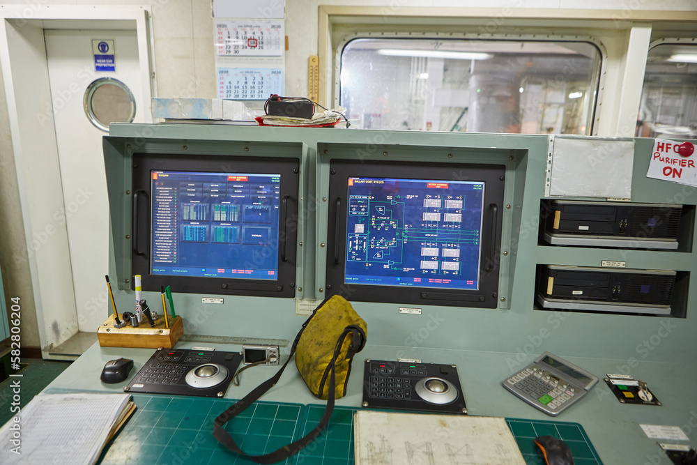 Interior of ship's engine room control compartment. The control ...