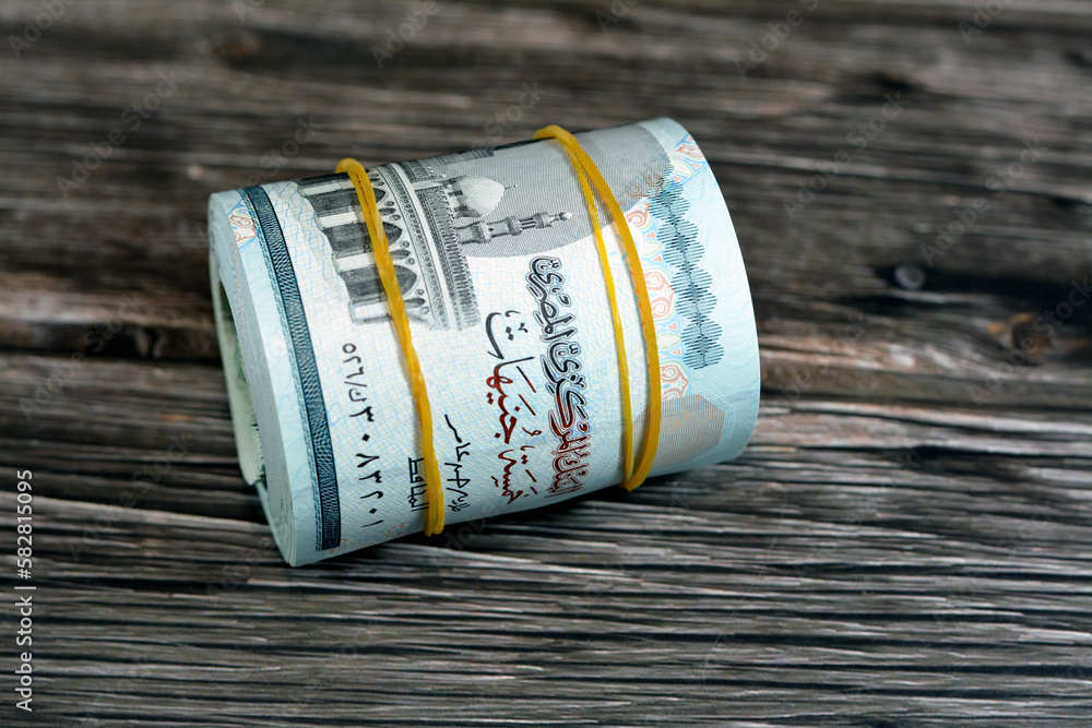 5 EGP LE five Egyptian pounds cash money bills rolled up with rubber ...