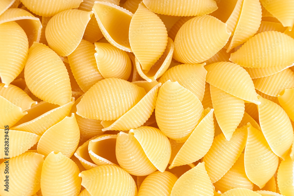 Conchiglioni spaghetti pattern, food background. Raw pasta, ingredient ...