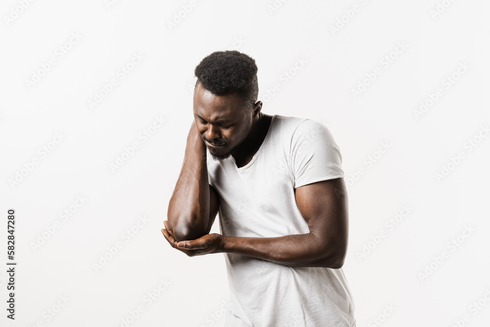 Foto de Elbow injury of african american man isolated on white ...