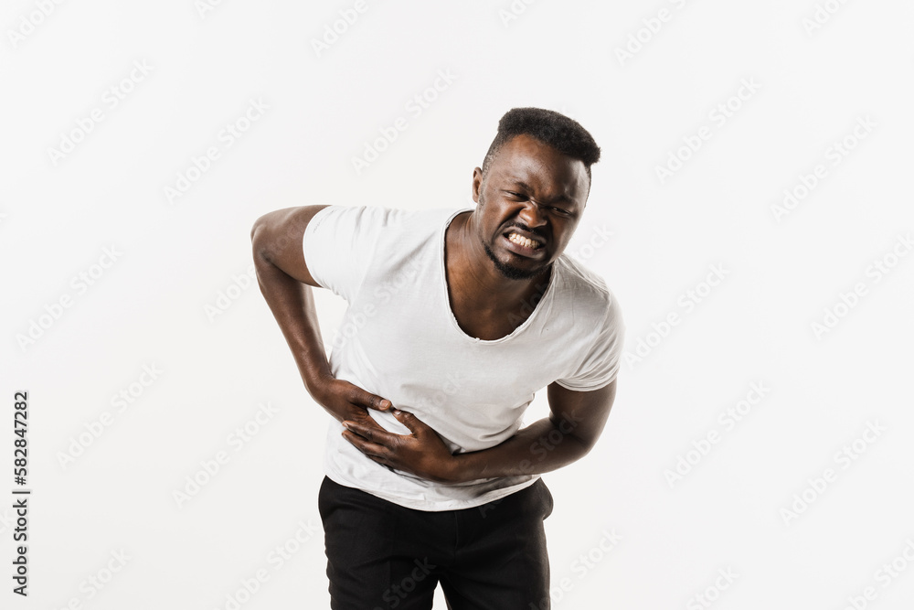Appendicitis is inflammation of appendix. African american man feel ...