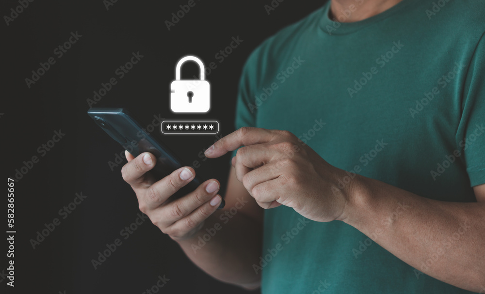 Business Technology Cyber Security Concept. Asian businessman using the smart mobile phone to ...